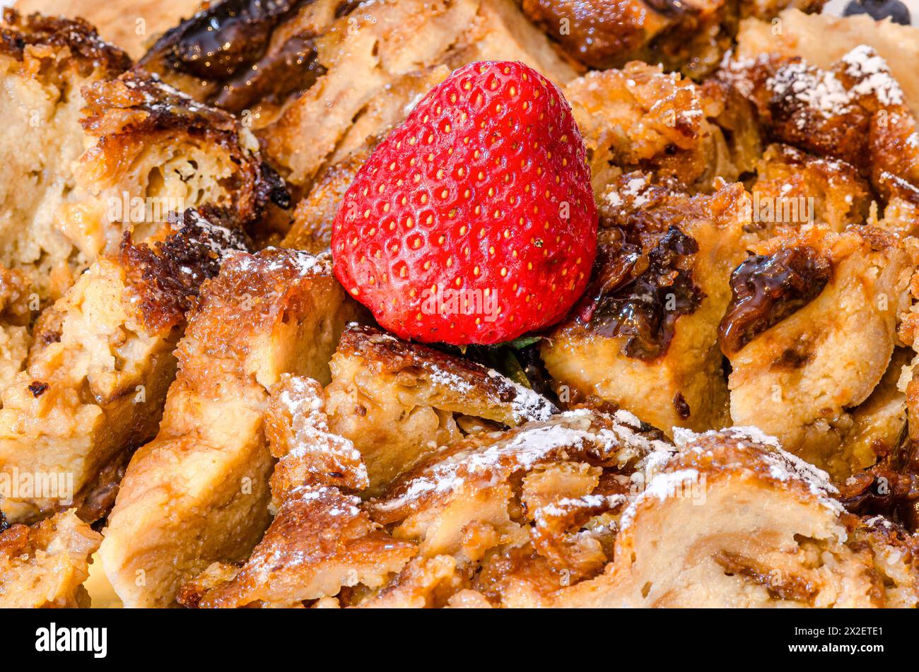 sweet food pudding, strawberry garnish Stock Photo - Alamy
