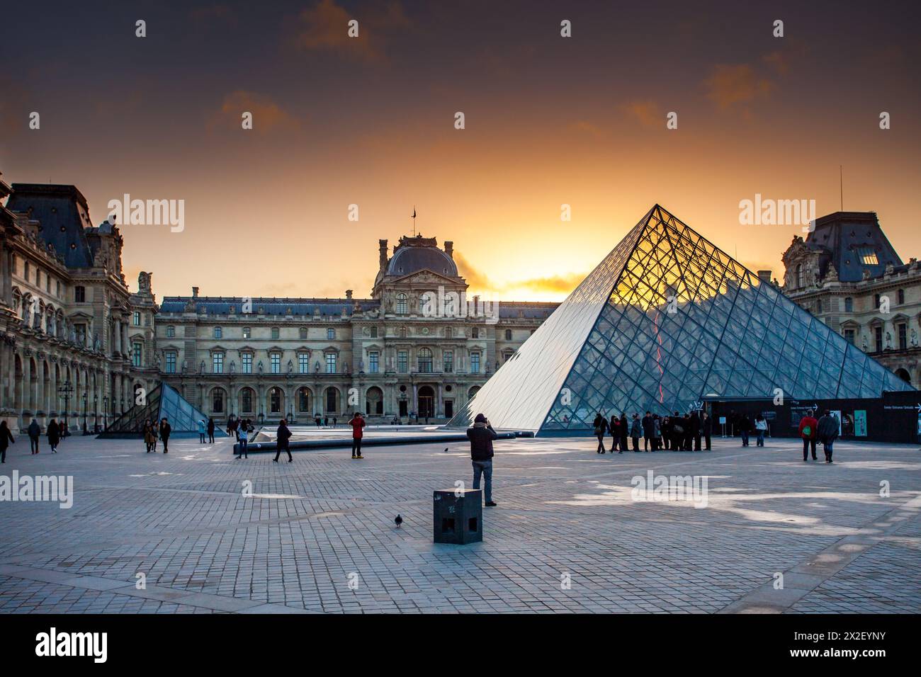 "Sunset over Louvre Museum with iconic glass pyramid Stock Photo - Alamy