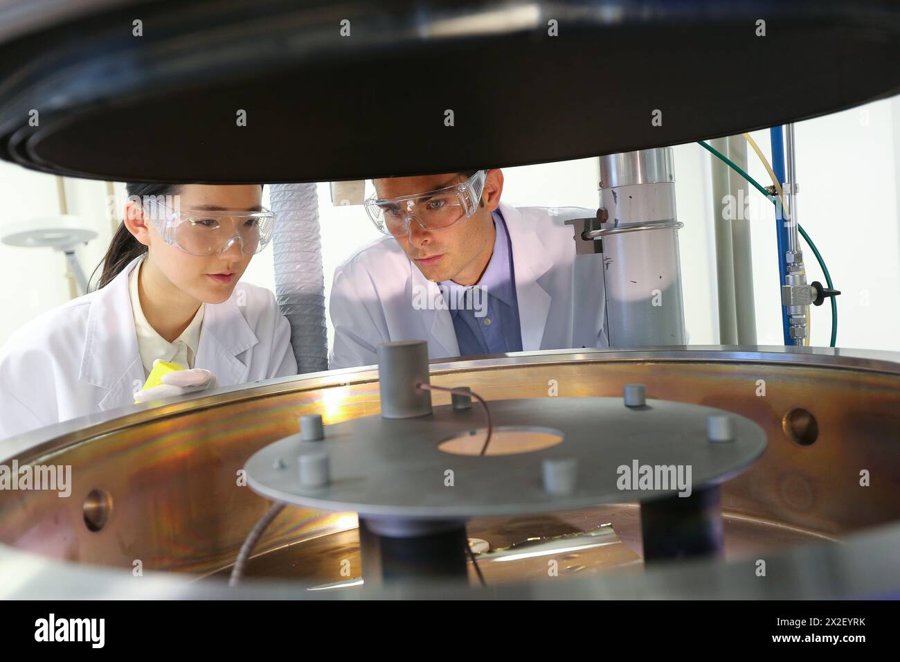 Researchers. Active screen plasma nitriding system. Vacuum chamber ...