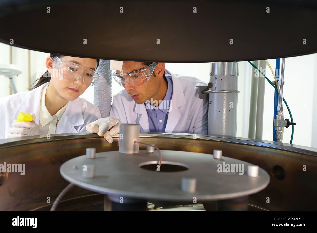 Researchers. Active screen plasma nitriding system. Vacuum chamber ...