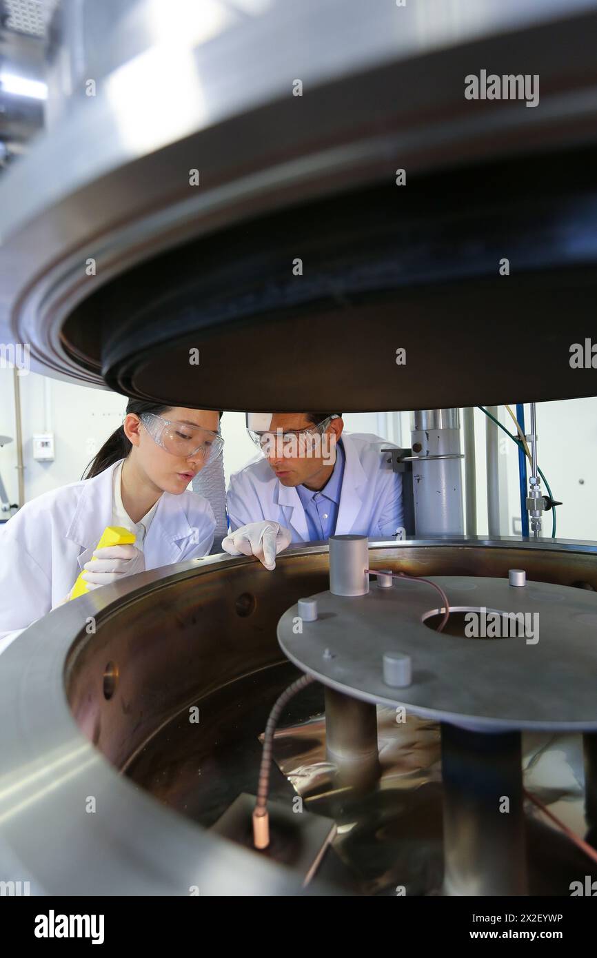 Researchers. Active screen plasma nitriding system. Vacuum chamber ...