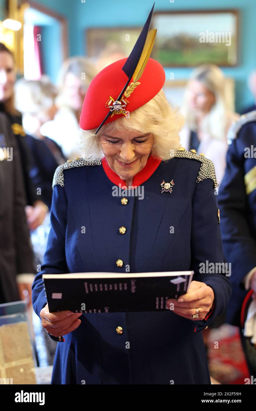 Queen Camilla views a photograph of Veteran Royal Lancers including ...