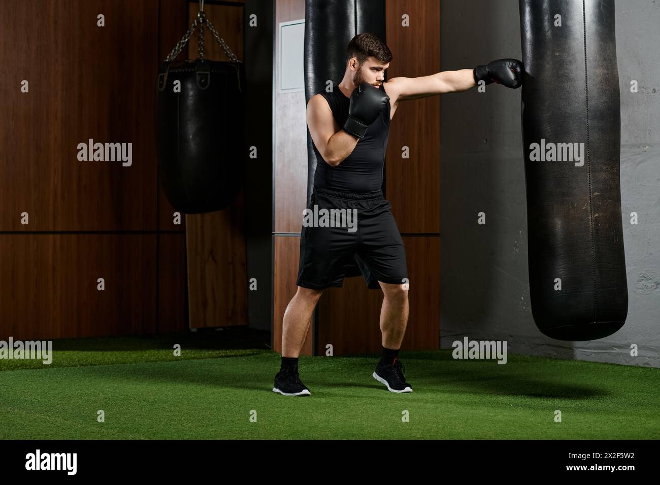Bearded man in black sportswear hi-res stock photography and images - Alamy