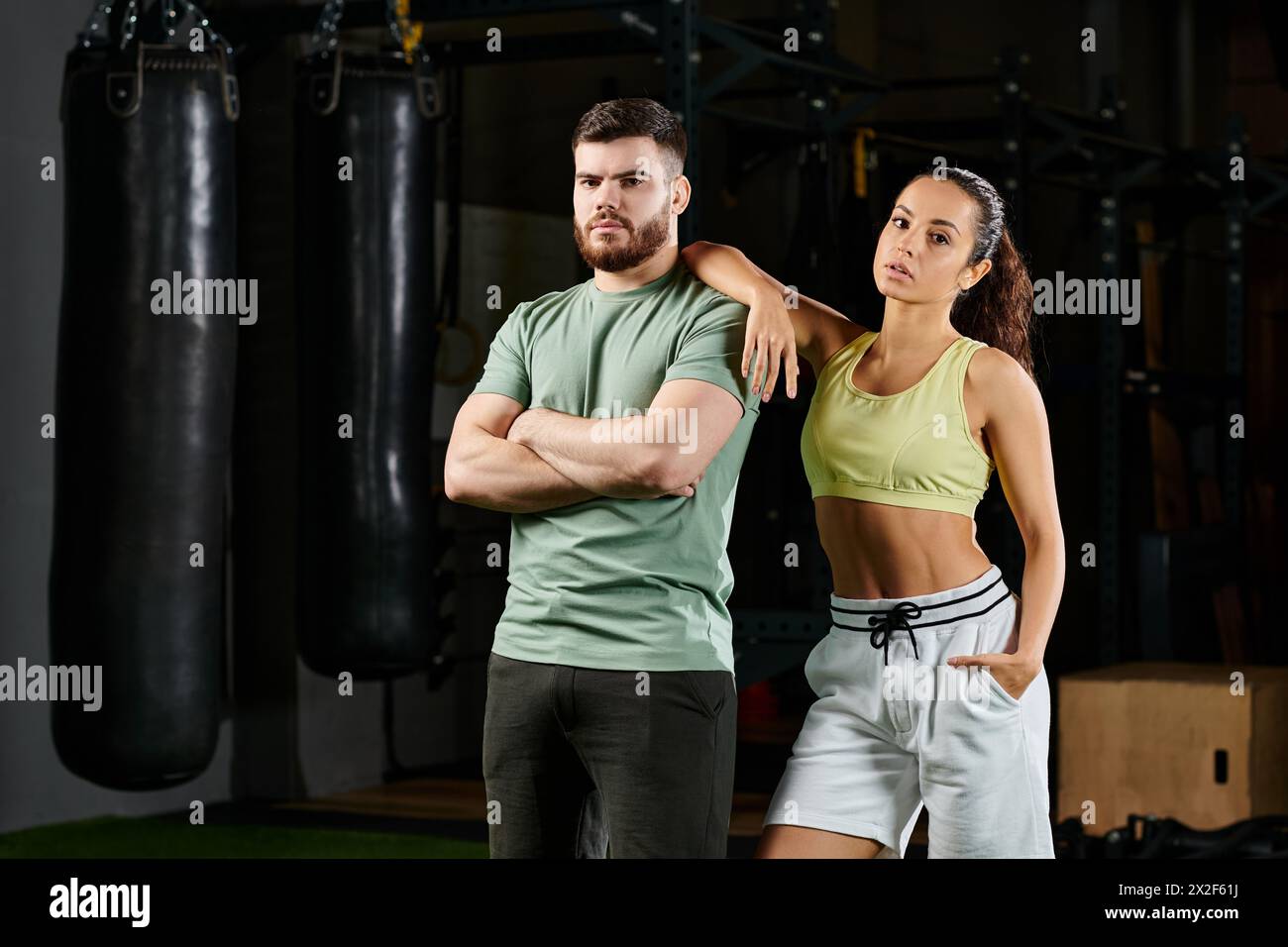 A male trainer instructs a woman in self-defense techniques in a gym Stock Photo - Alamy
