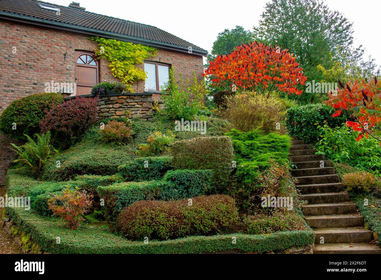 House and landscaped garden Photographed in the Ardennes, Belgium Stock ...