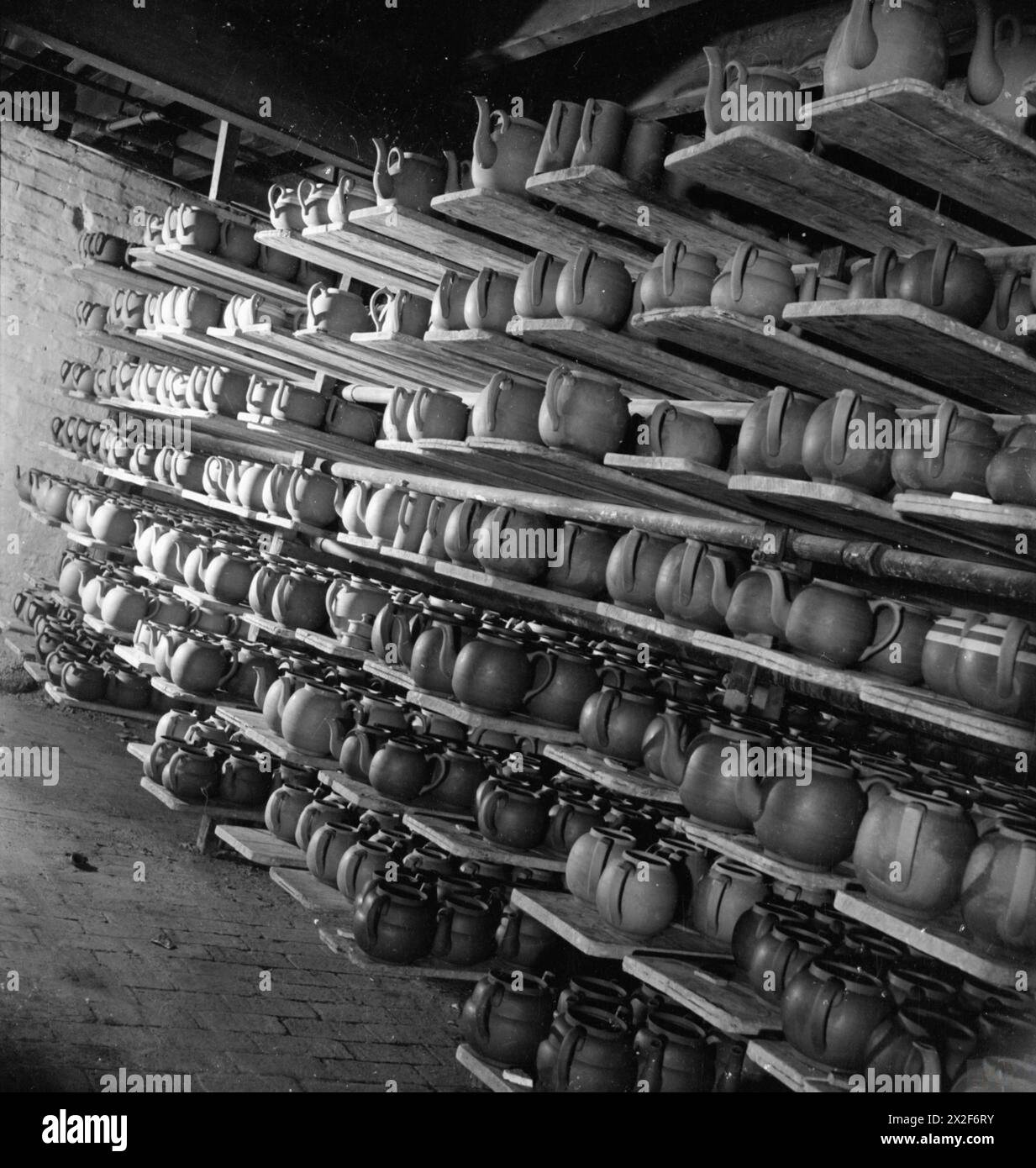 Hundreds of teapots are stacked on drying racks at J & G Meakin Pottery ...