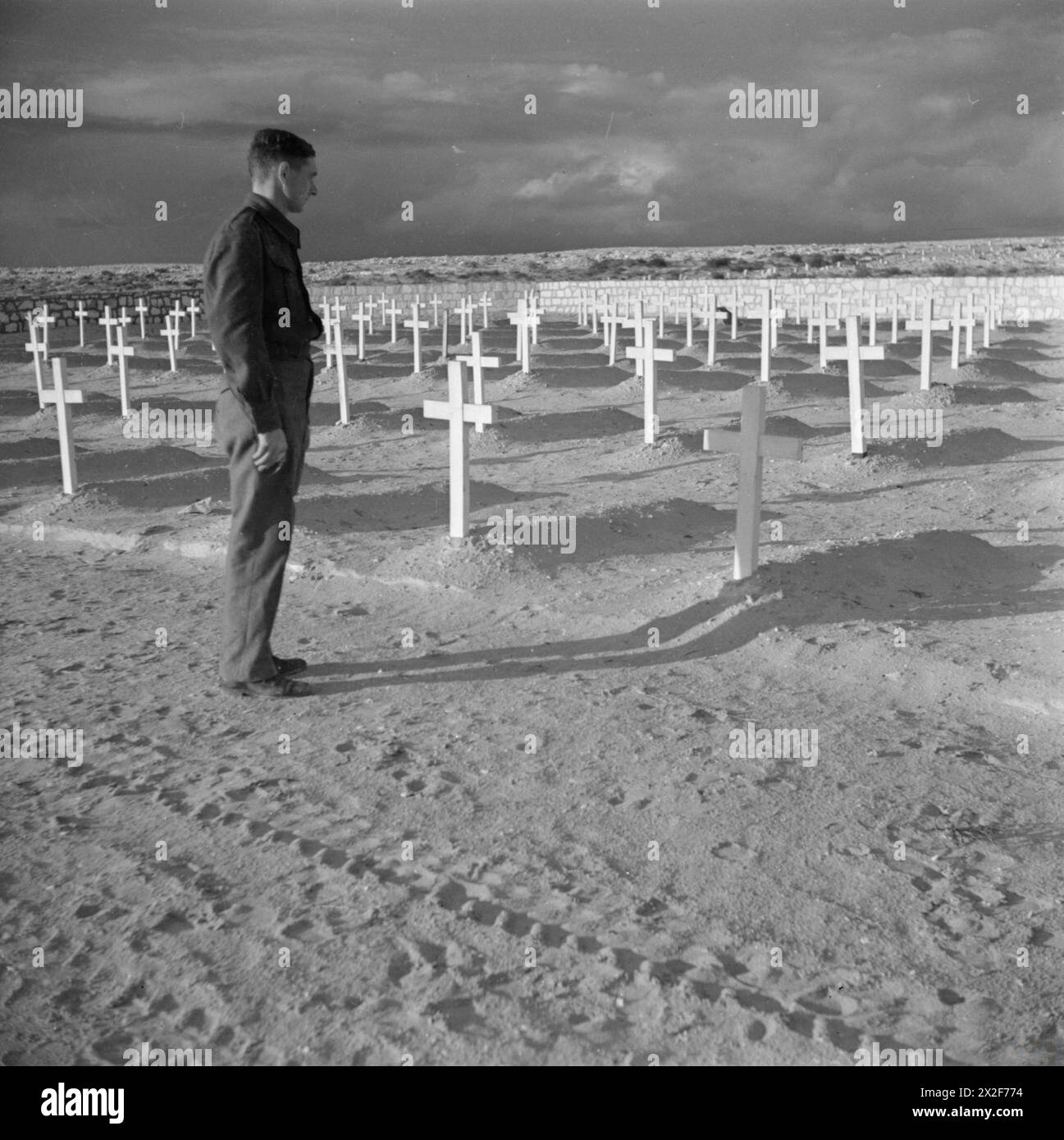 Driver J. Bottomley of the Graves Registration Unit collects and ...