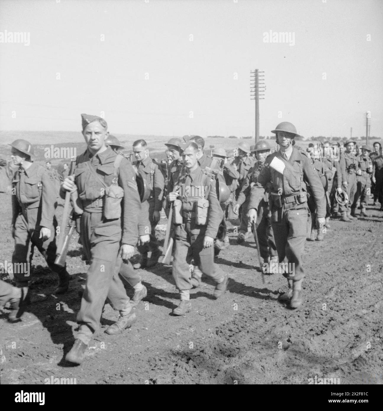 Infantry soldiers of the British Army's 46th Division march along the ...