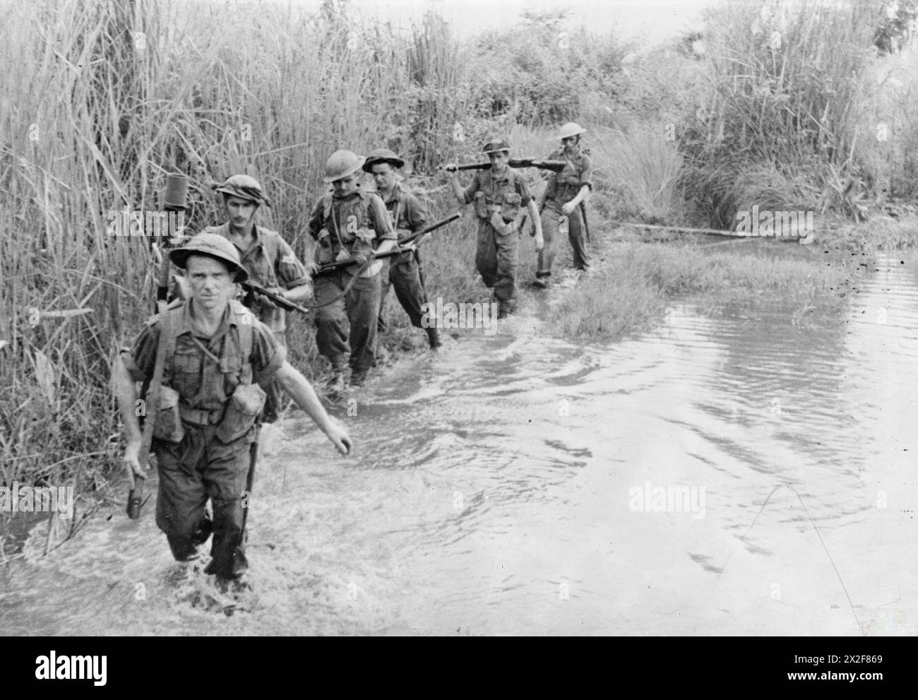 A section of the British Army conducts a patrol in Burma during 1944 ...