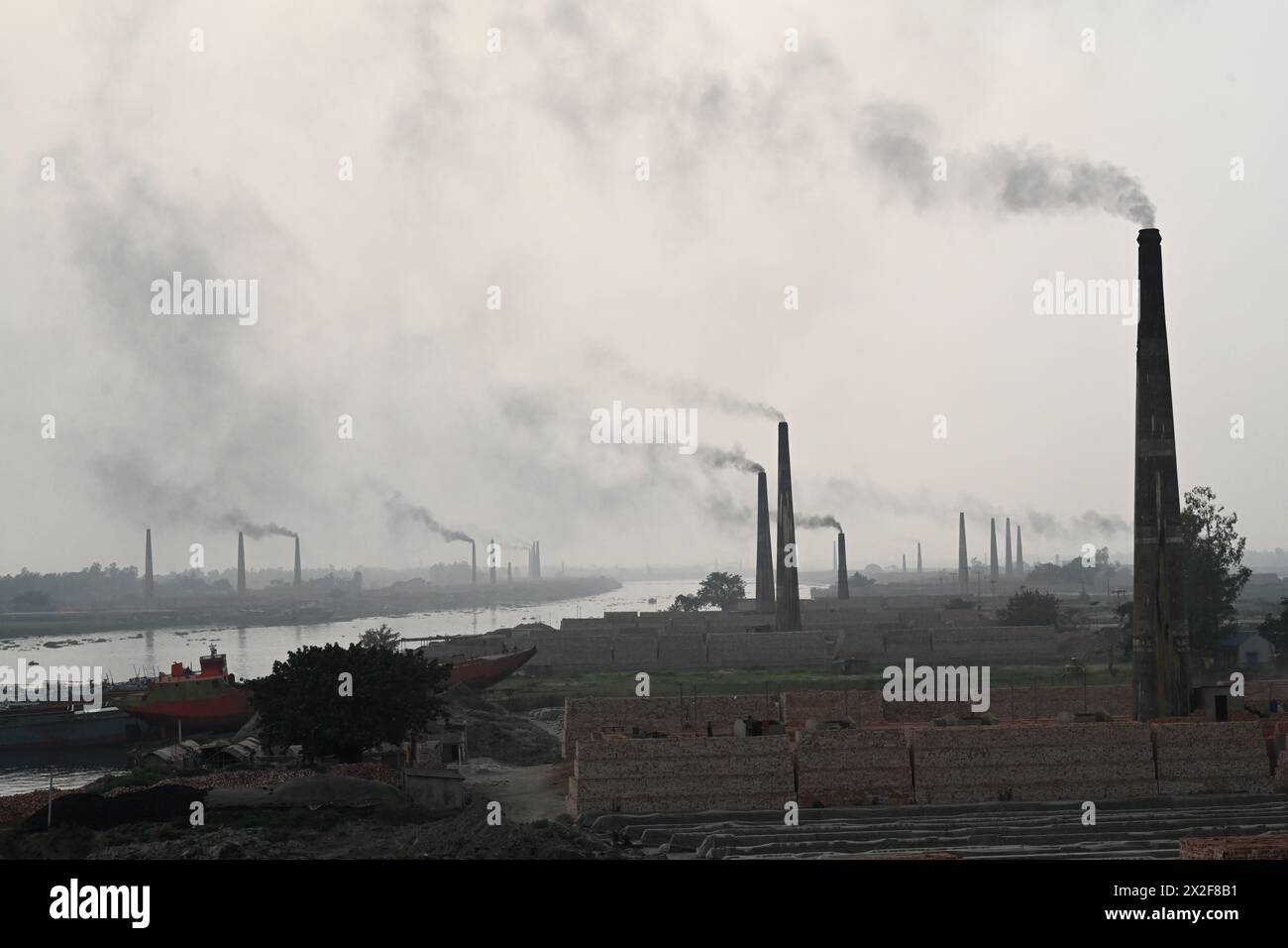 Dhaka, Bangladesh. 22nd Apr, 2024. Smoke is emitting from chimneys at a ...