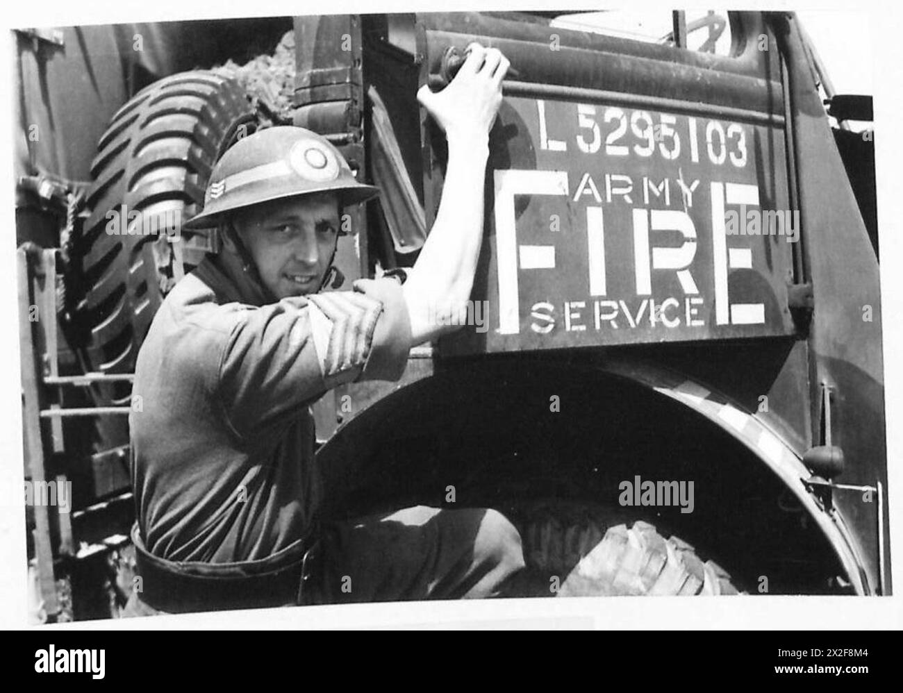 THE ARMY FIRE SERVICE - Sgt. E. J. Allen of Luton, Beds, who drives one ...