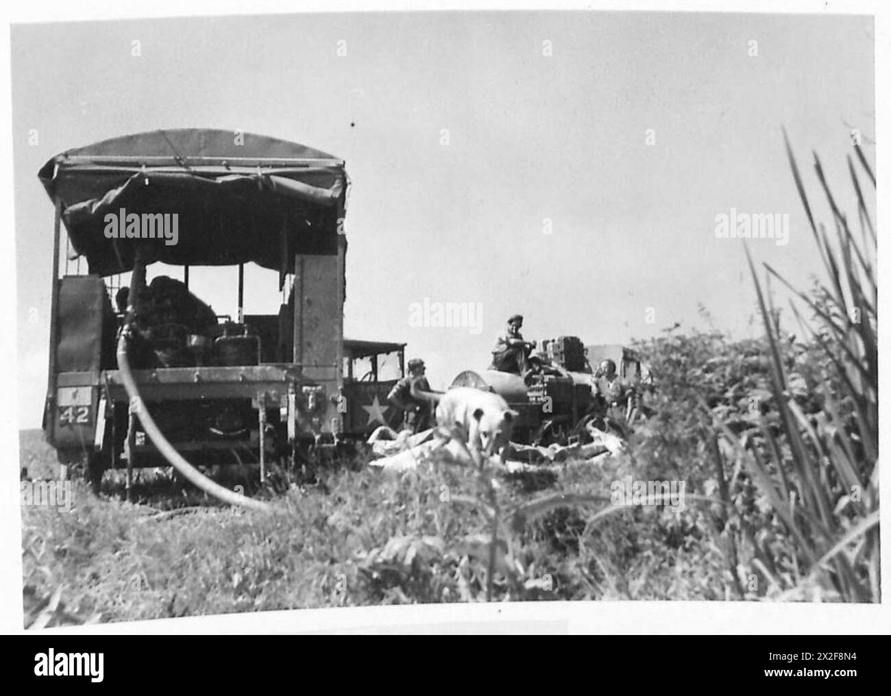 A trailer water purifier pumps purified water into a cart in Normandy ...
