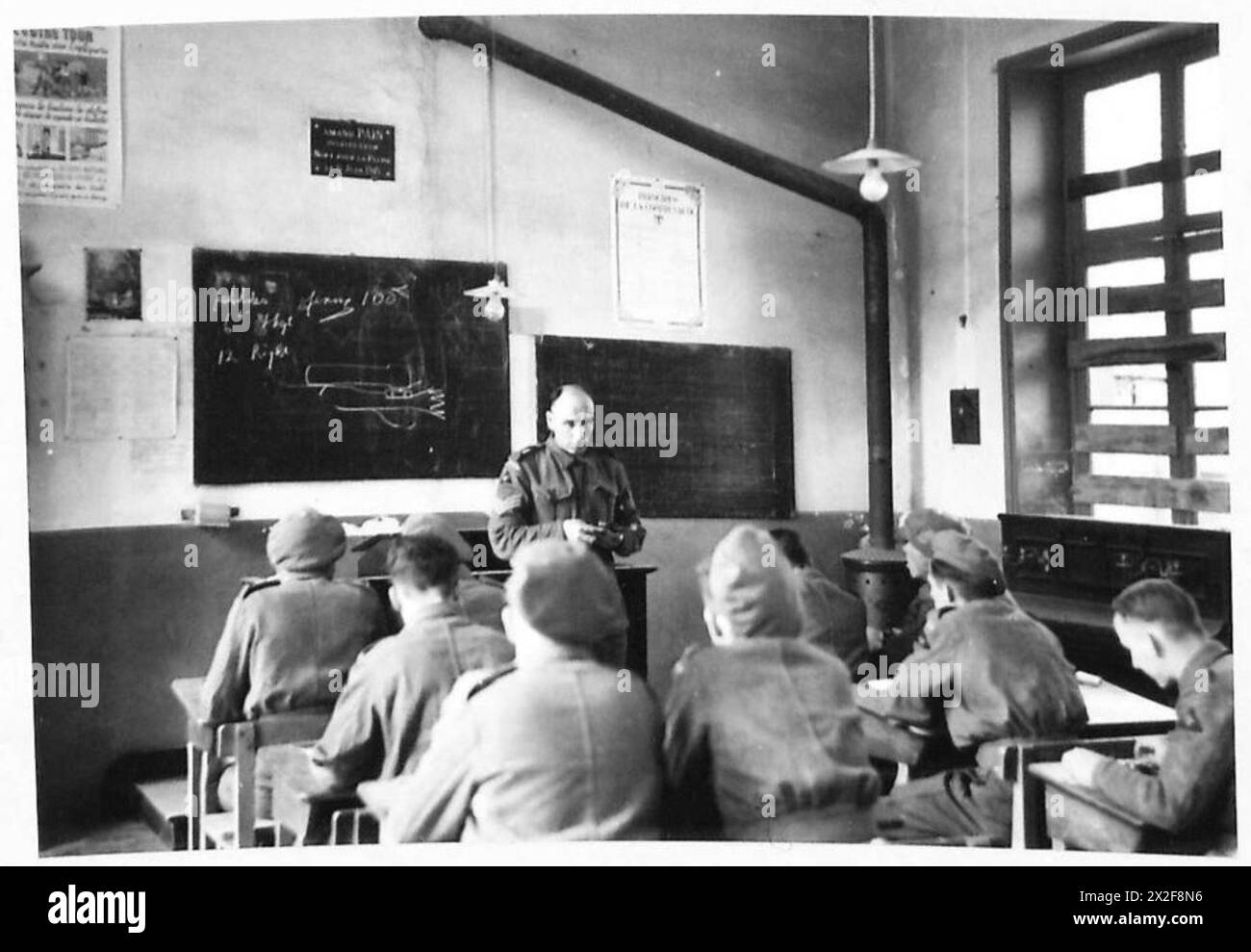 SCHOOL FOR SNIPERS - The tiny schoolroom of a Normandy village is used ...