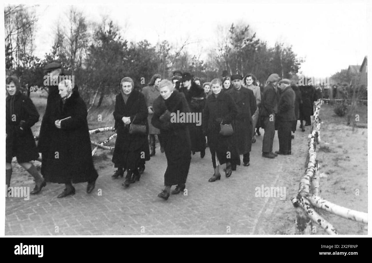 Civilians walk toward a church during evacuation in British-occupied ...
