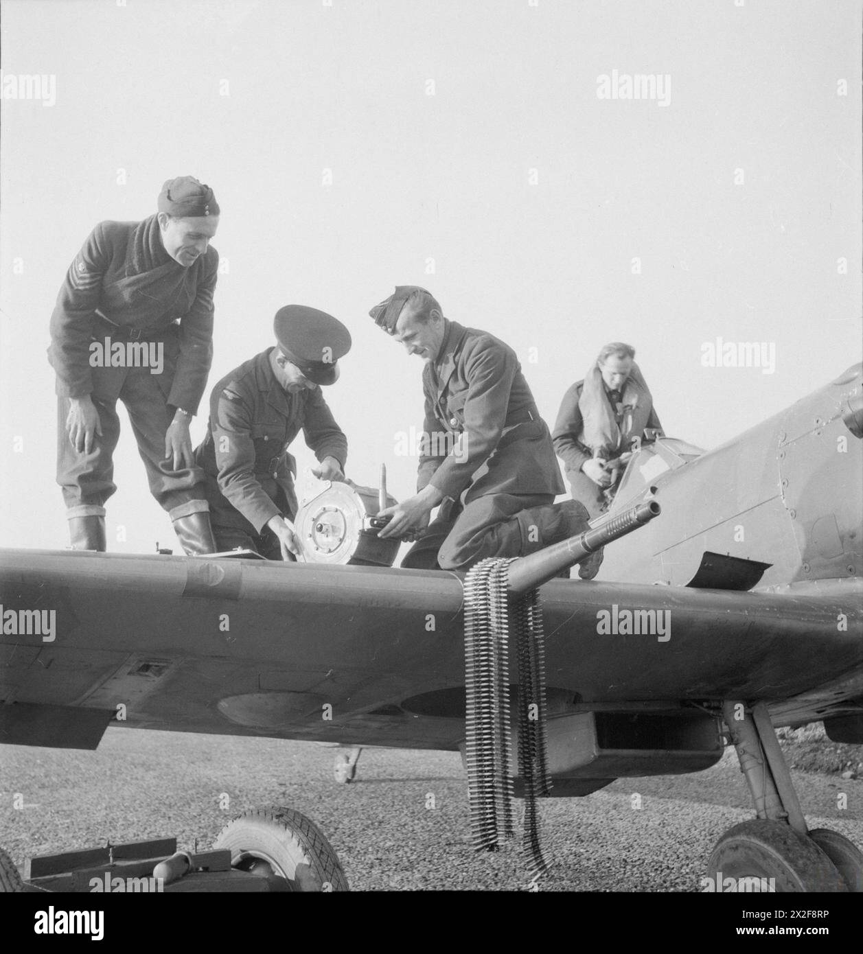 Armourers of No. 306 Polish Fighter Squadron reload Spitfire 20 mm ...