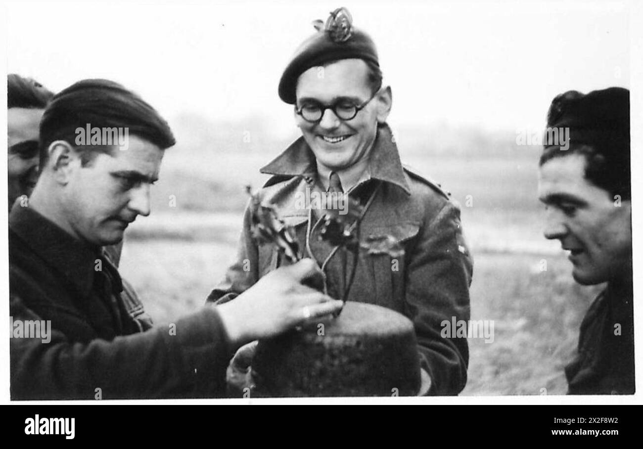 CHRISTMAS IN THE FRONT LINE - The Platoon Officer holds the plum ...