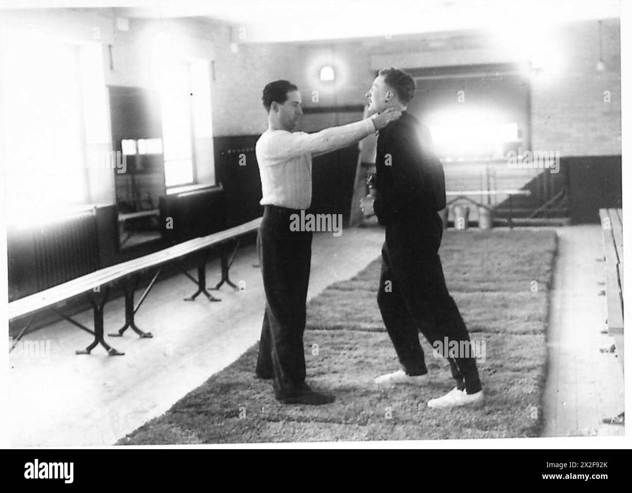 A recruit is being taught self-defense techniques as part of training ...
