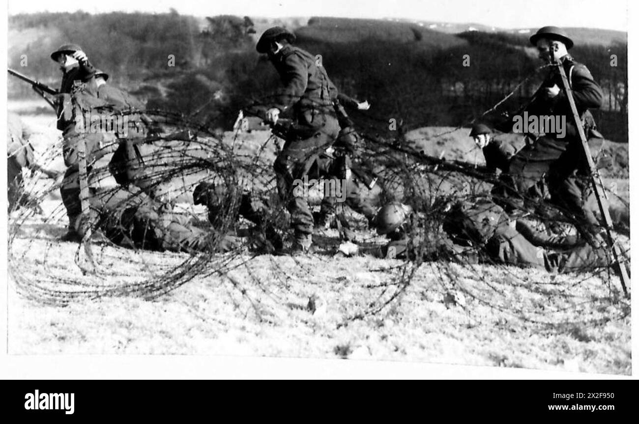 COMMANDOS IN TRAINING - Demonstrating a quick way of crossing barbed ... COMMANDOS IN TRAINING - Demonstrating a quick way of crossing barbed ...