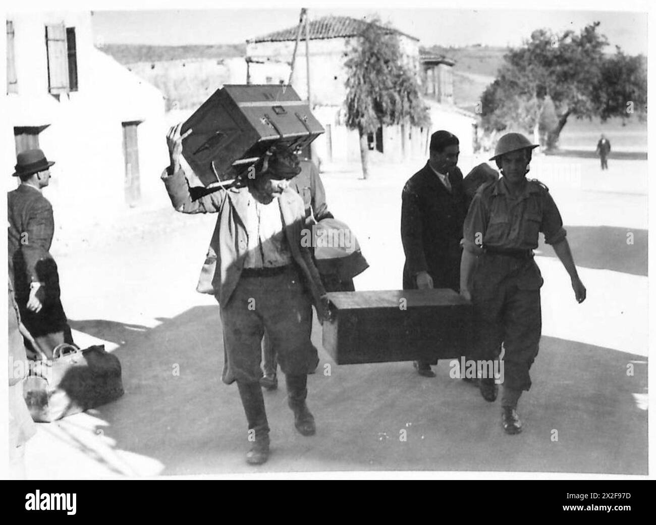 PICTURES FROM GREECE - A British soldier being assisted by a Greek in ...