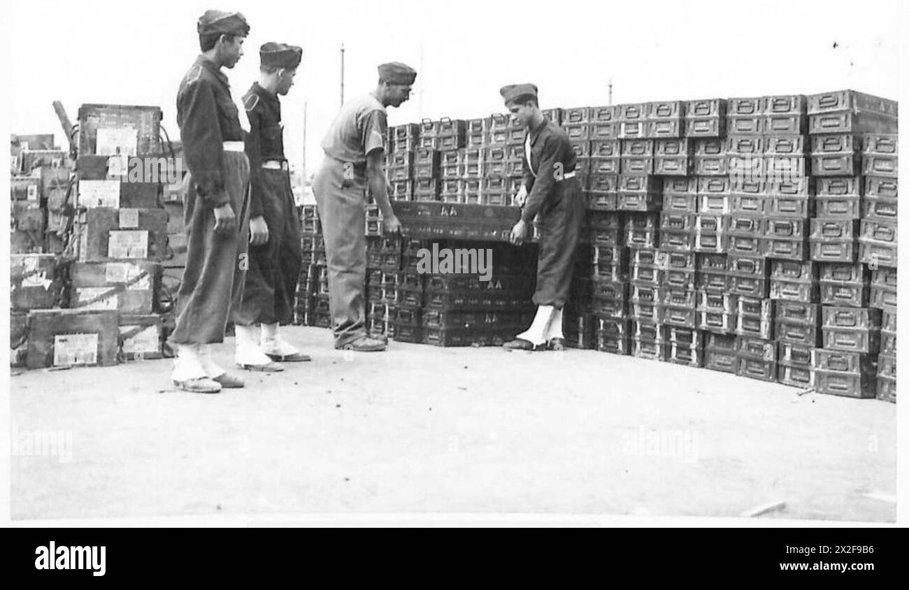 WITH THE BRITISH AIR FORCE IN GREECE - A Greek soldier lends a hand to ...