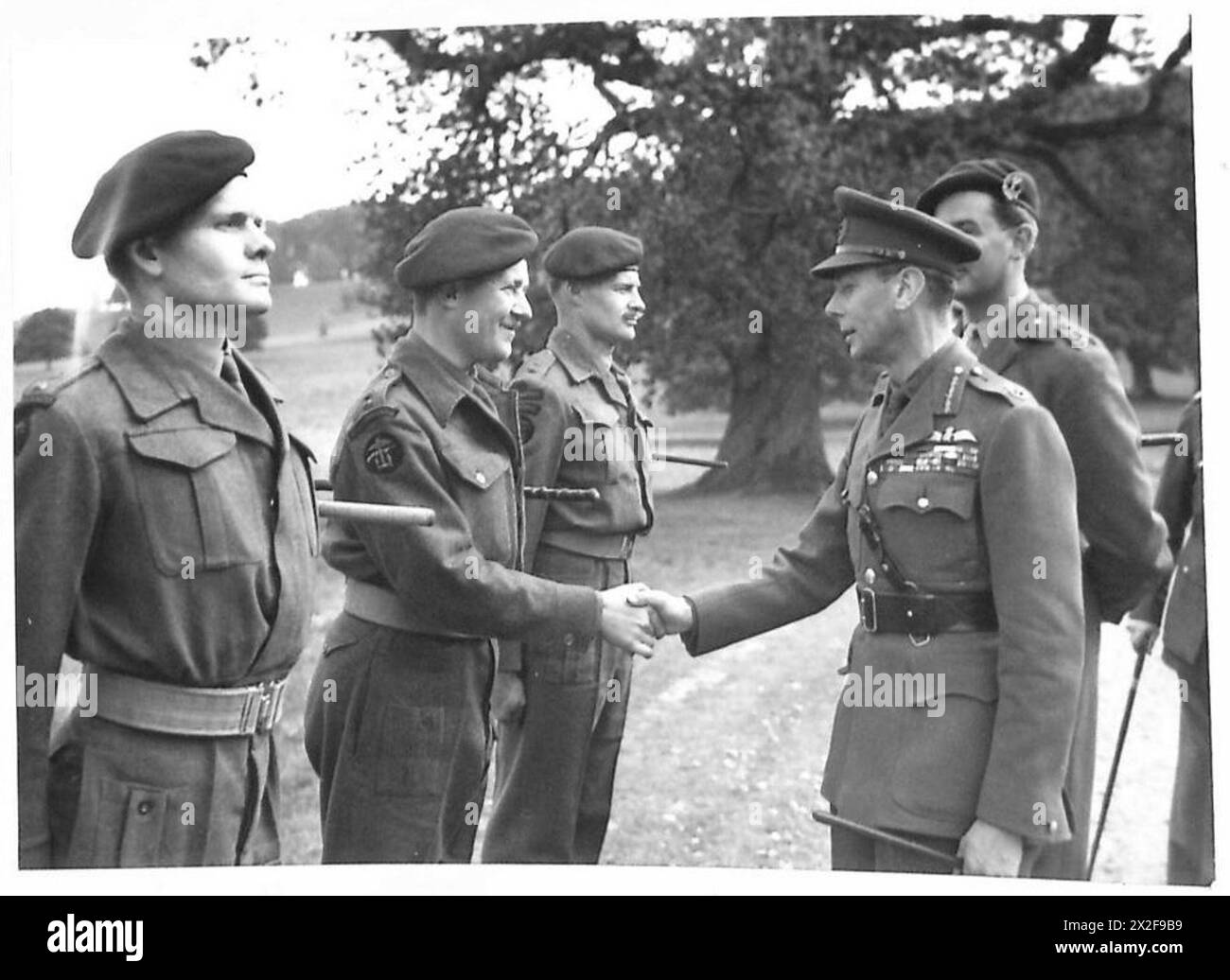 H.M. THE KING INSPECTS INVASION TROOPS - The King shakes hands with ...