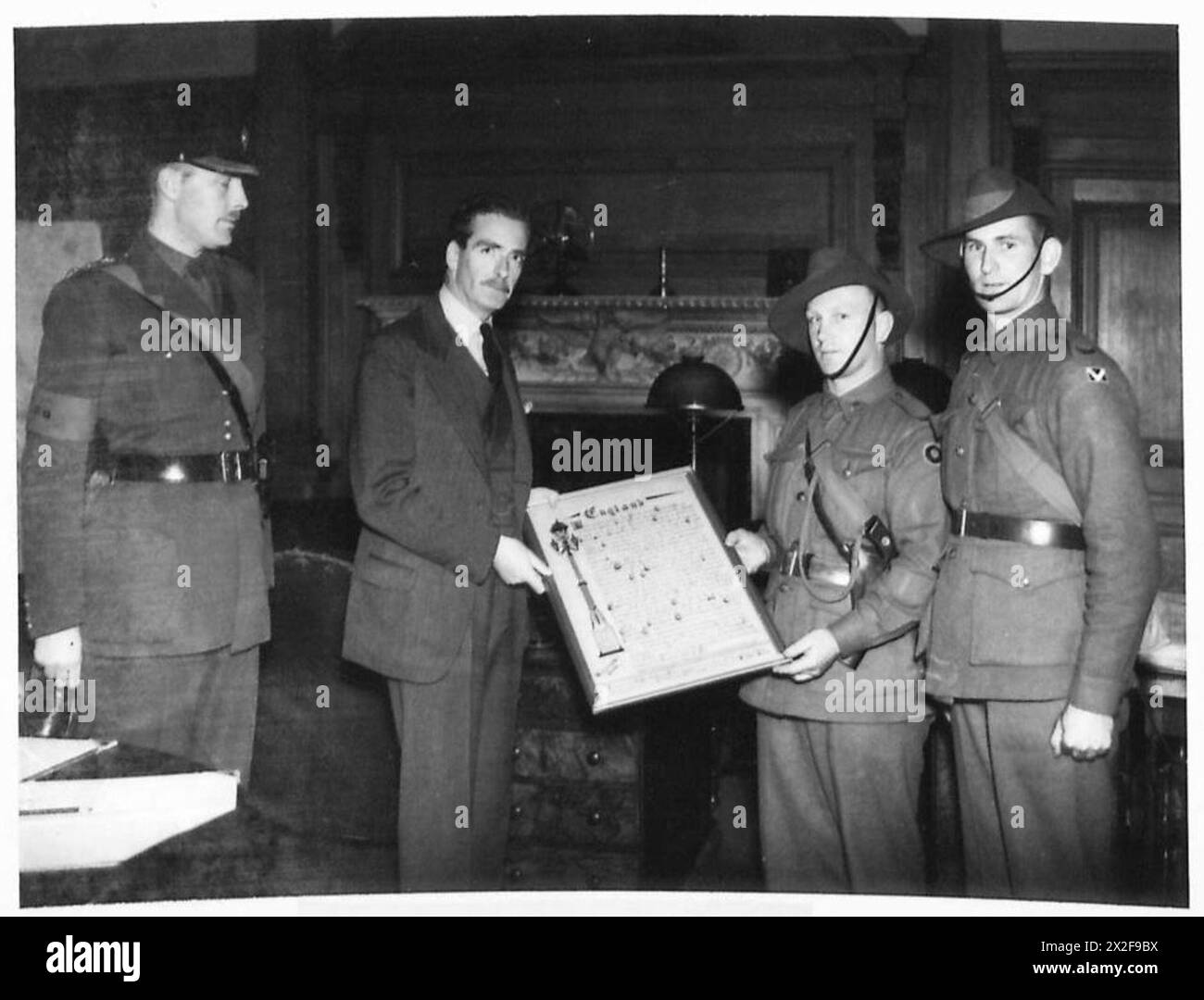 Mr. Eden is presented with documents or reports by Captain Chamberlain ...
