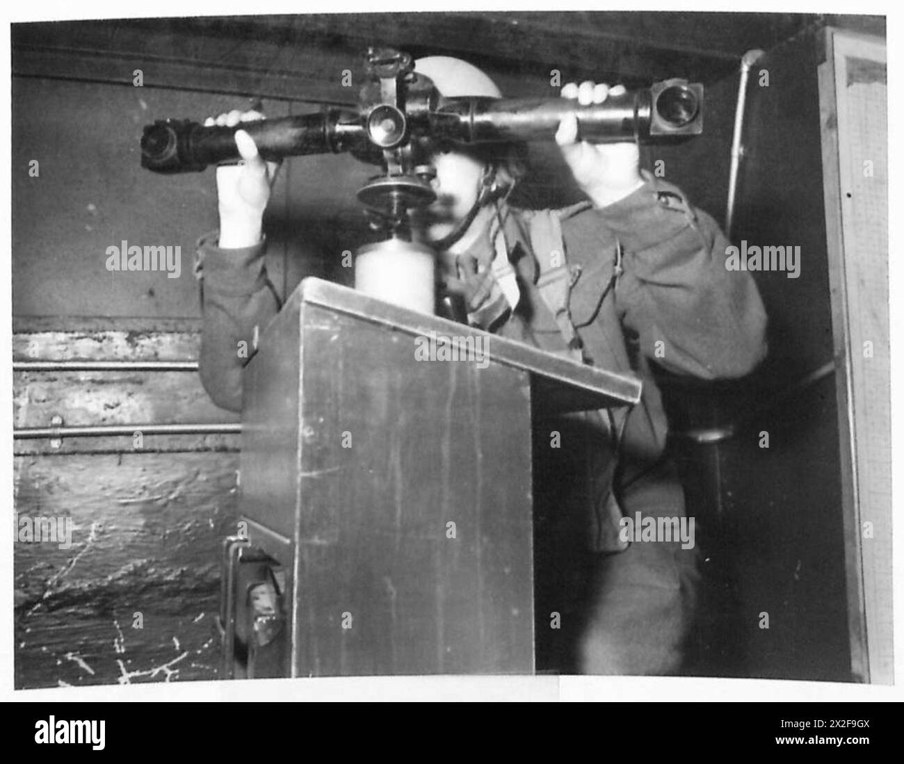 Battery Commander in a British Army observation post monitors artillery ...