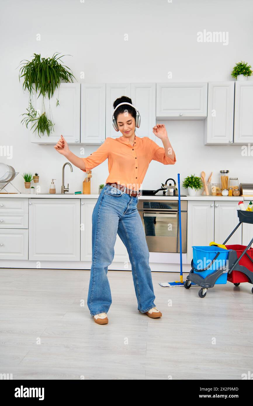Woman cleaning kitchen home dancing hi-res stock photography and images ...
