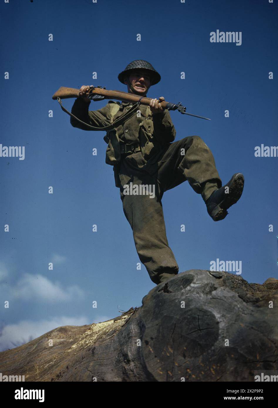 Private T. Henderson of the British Army practices an assault with a ...