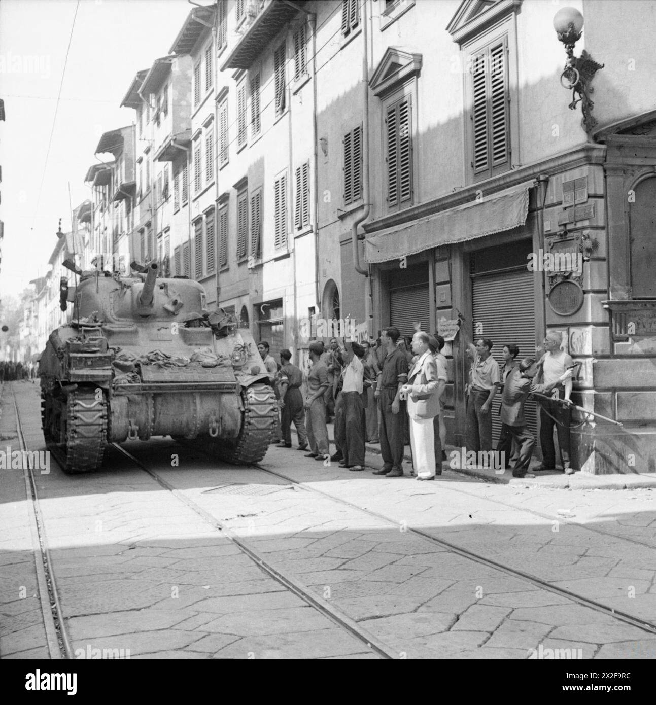 A British Army Sherman tank enters Florence, Italy, on 4 August 1944 ...