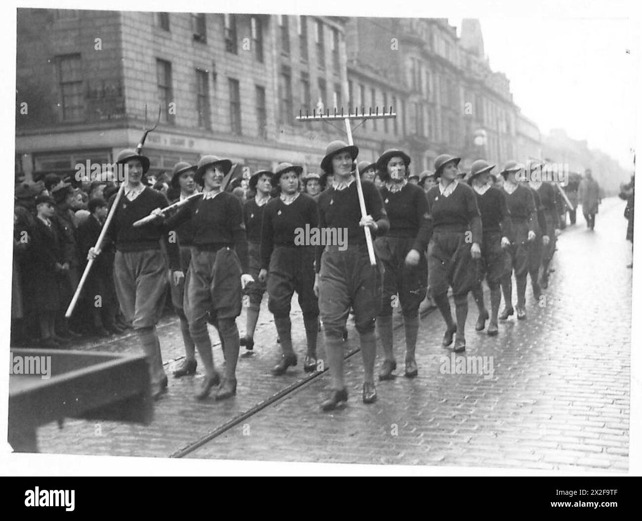 During Aberdeen War Weapons Week, Land Girls march past British Army ...