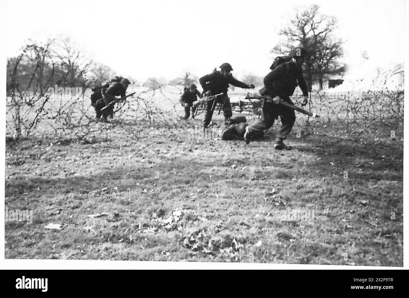 Troops of the Royal Welsh Fusiliers are shown rushing forward during ...