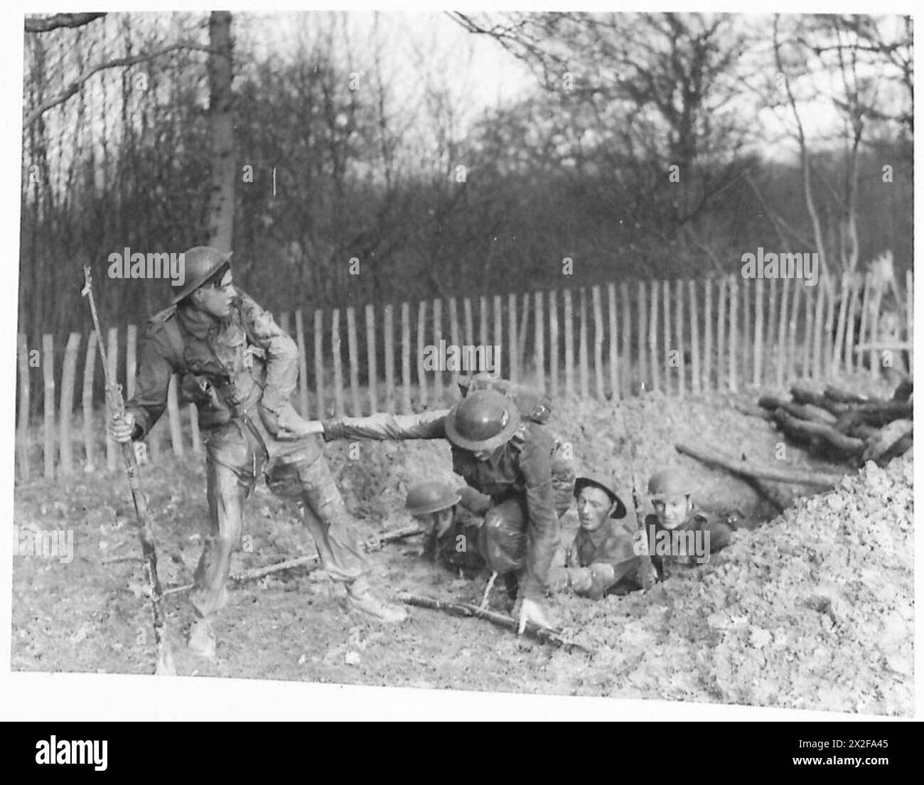STRENUOUS TRAINING AT BATTLE SCHOOL - Men emerging from a mud bath ...