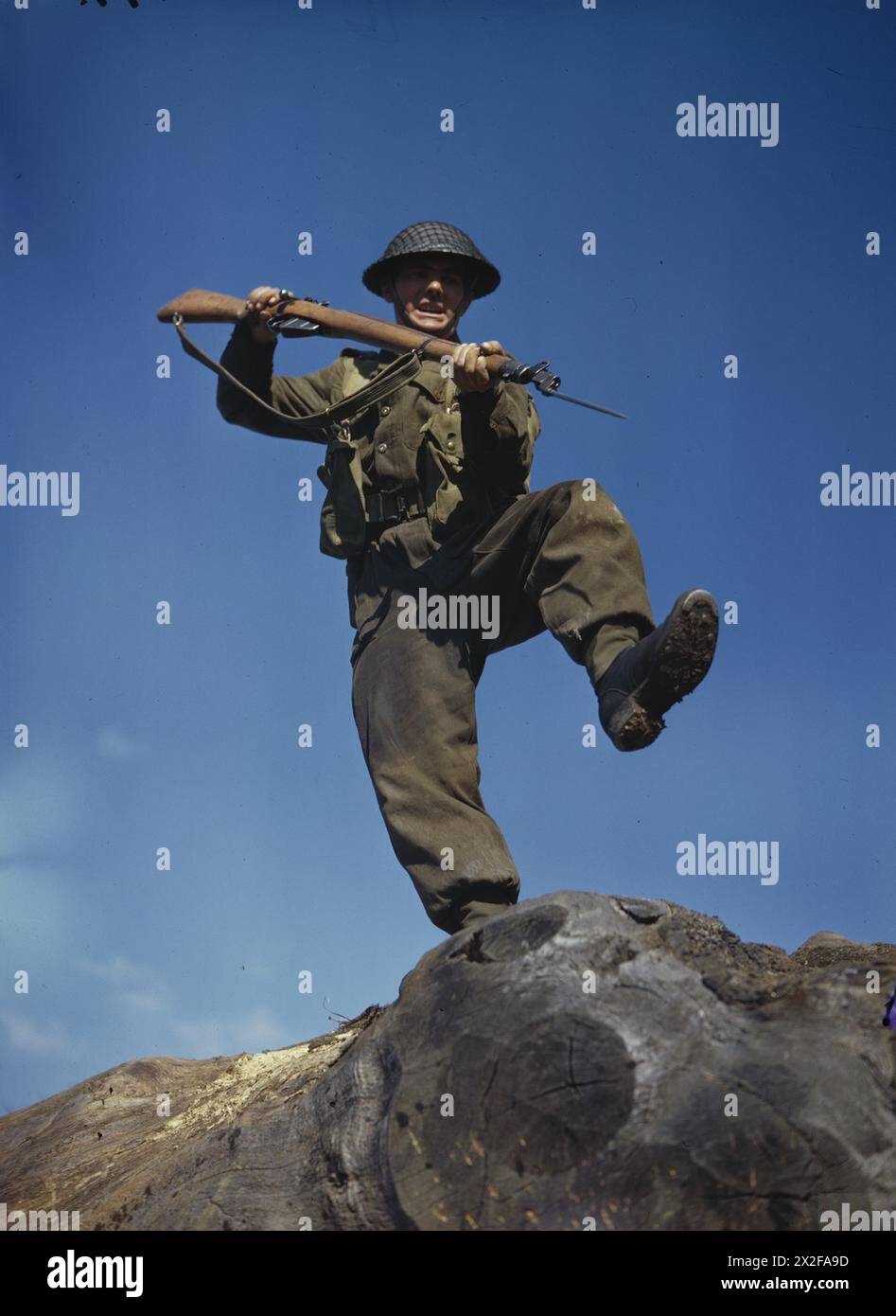 In Britain during 1944, Private T. Henderson practiced bayonet assault ...