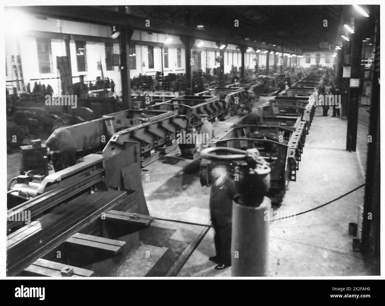 SARDINE TINS TO TANKS - Line of Hulls , British Army Stock Photo - Alamy