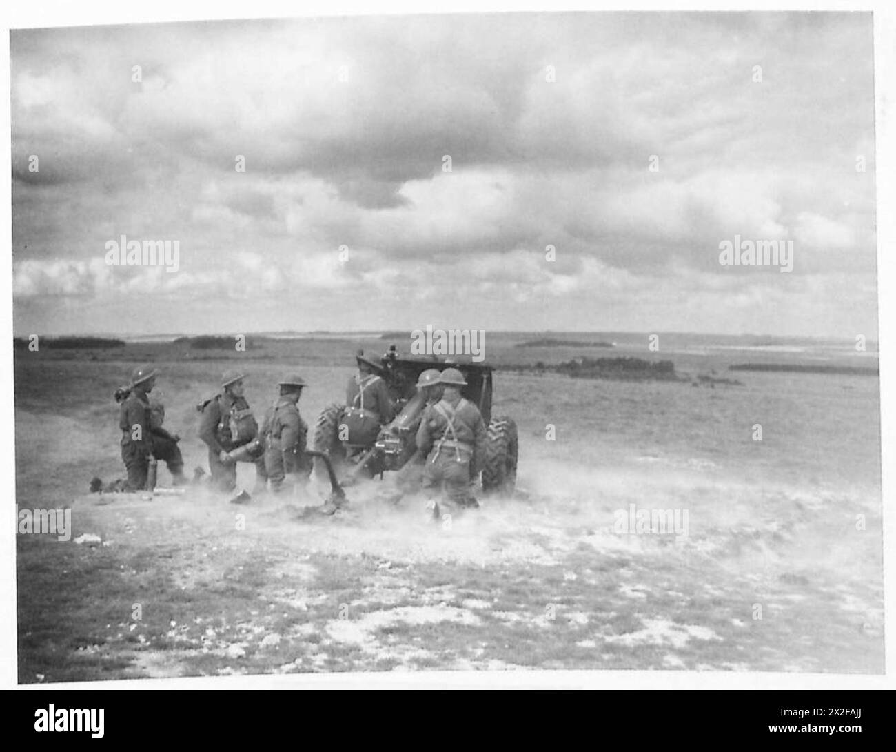 British Army personnel fire an artillery gun during a training exercise ...