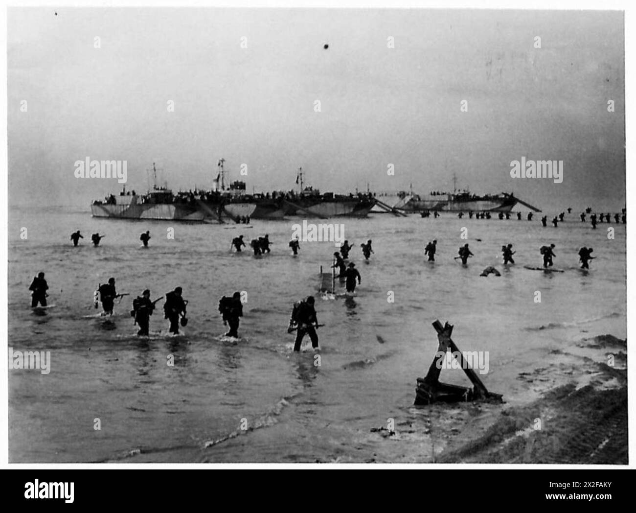 BRITAIN'S ARMY TRAINS FOR THE INVASION OF EUROPE - Troops wading ashore ...