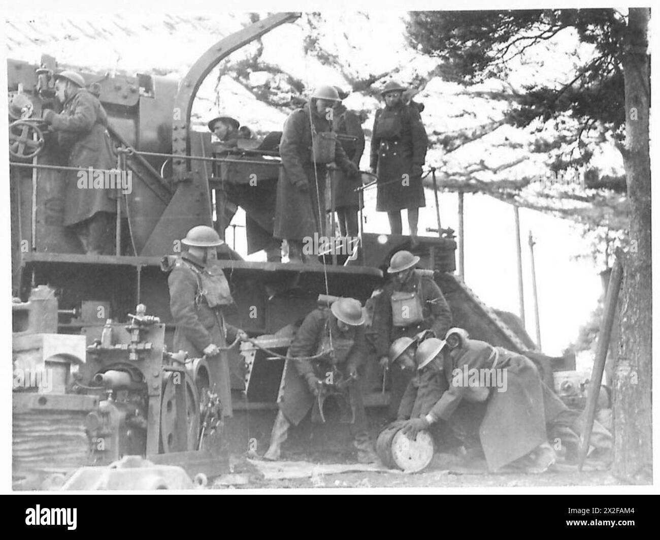 ONE OF BRITAIN'S TEETH - Preparing to hoist a shell on to the loading ...