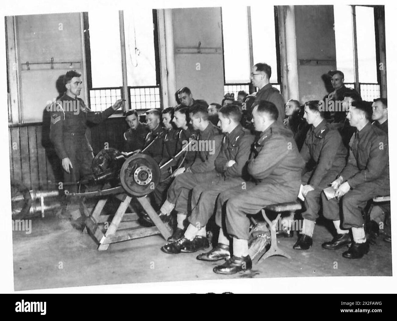 An instructional class trains British Army personnel to operate ...