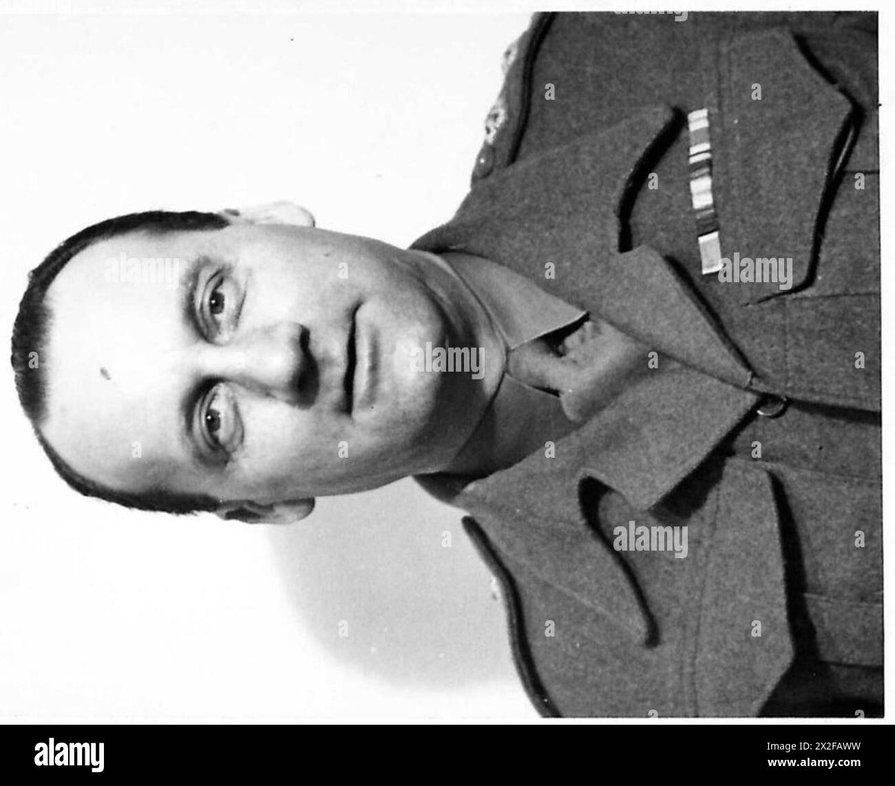 Captain E. Bacon, part of the No. 5 Public Relations Service, is ...