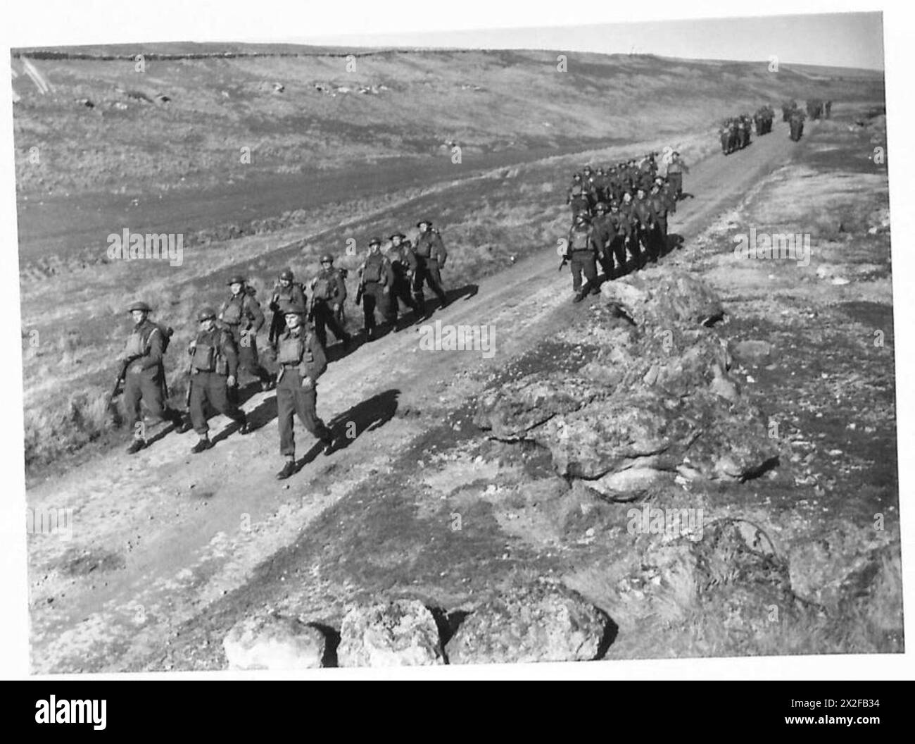 The Suffolk Regiment marches in battle order towards the scene of a ...