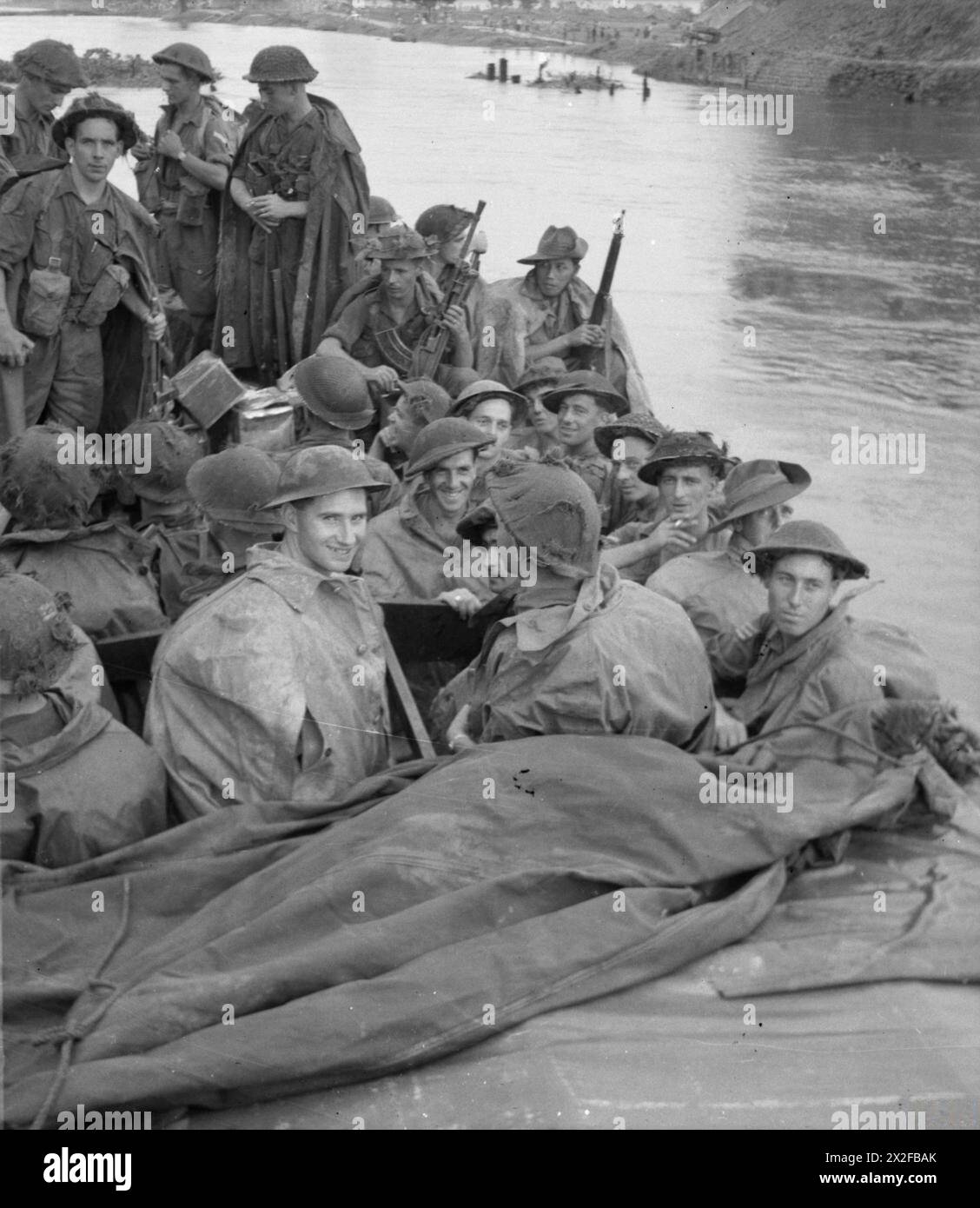 1st Battalion, Queen's Own Regiment patrols aboard an assault boat on ...
