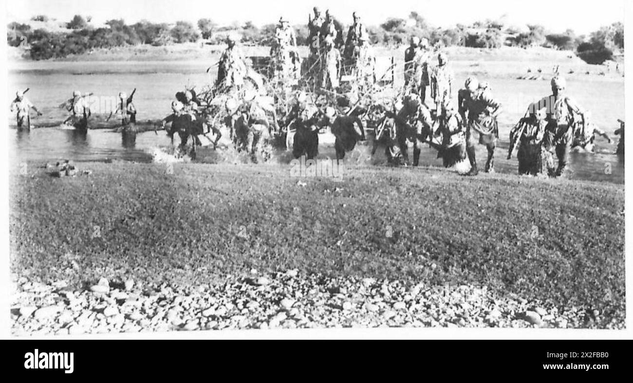 Troops of an Indian Infantry Brigade cross the Atbara River on a ...