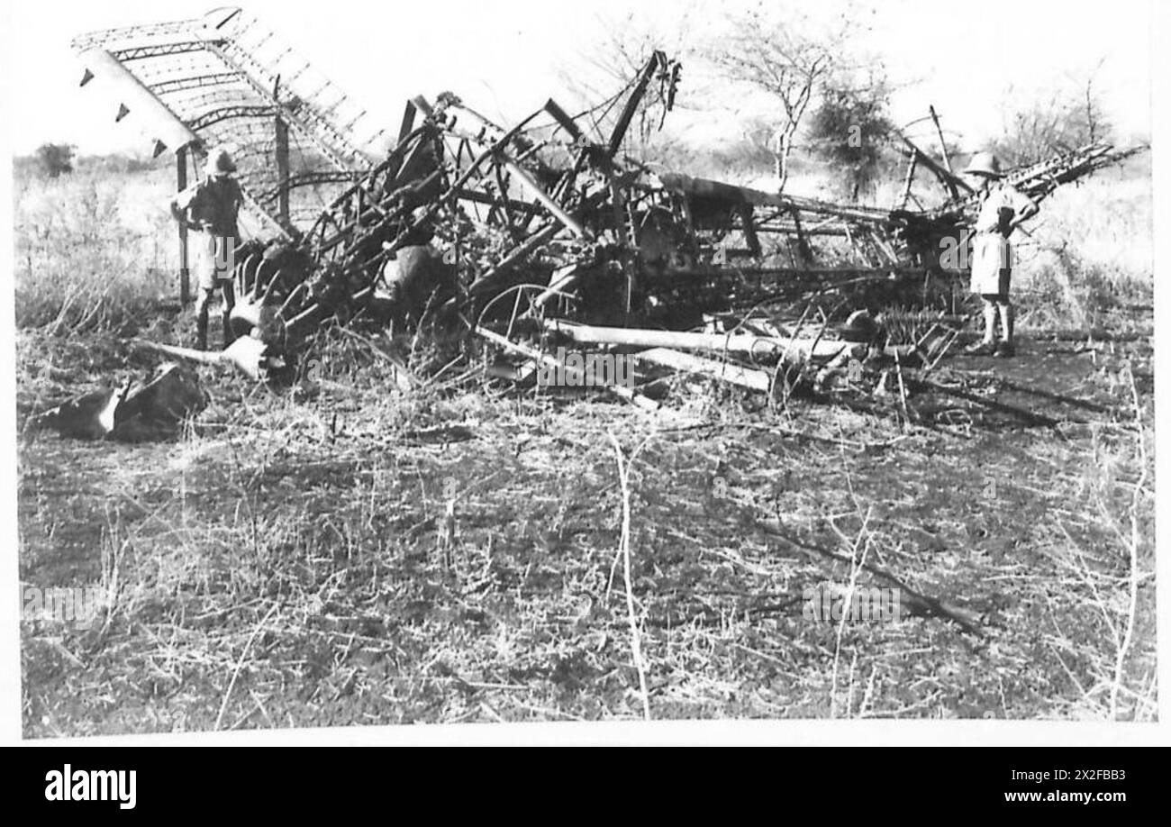 A burnt-out Italian aircraft lies on the Sudan-Abyssinian frontier ...