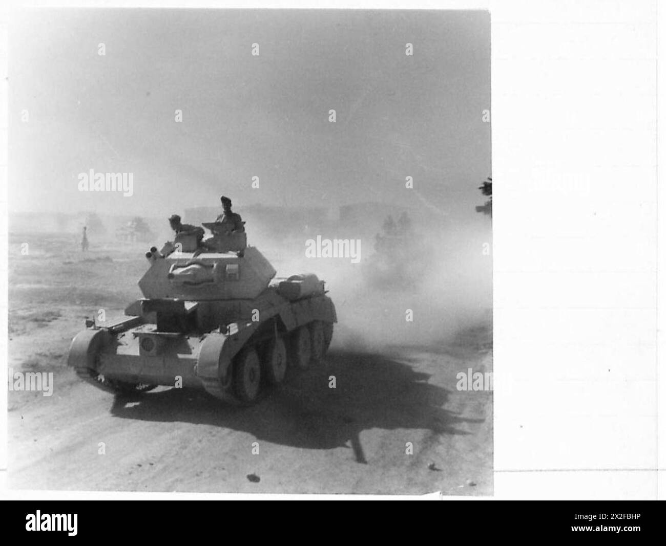 WITH THE HEAVY TANKS IN CYPRUS - A "Valentine" tank traverses some ...
