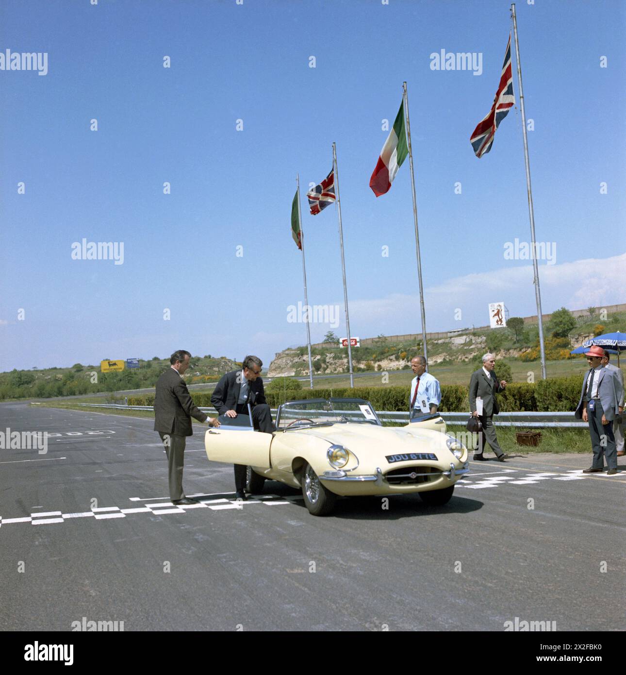 Jaguar E-type convertible, Series 1 1/2, in Pale Primrose Yellow, being demonstrated on the ...