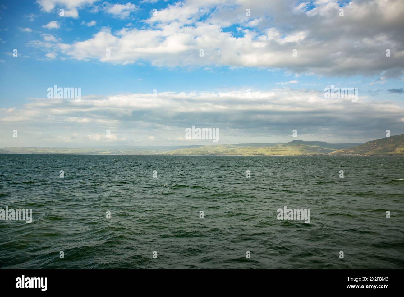 At water's edge on the shore of the Sea of Galilee, [Lake Kineret or ...