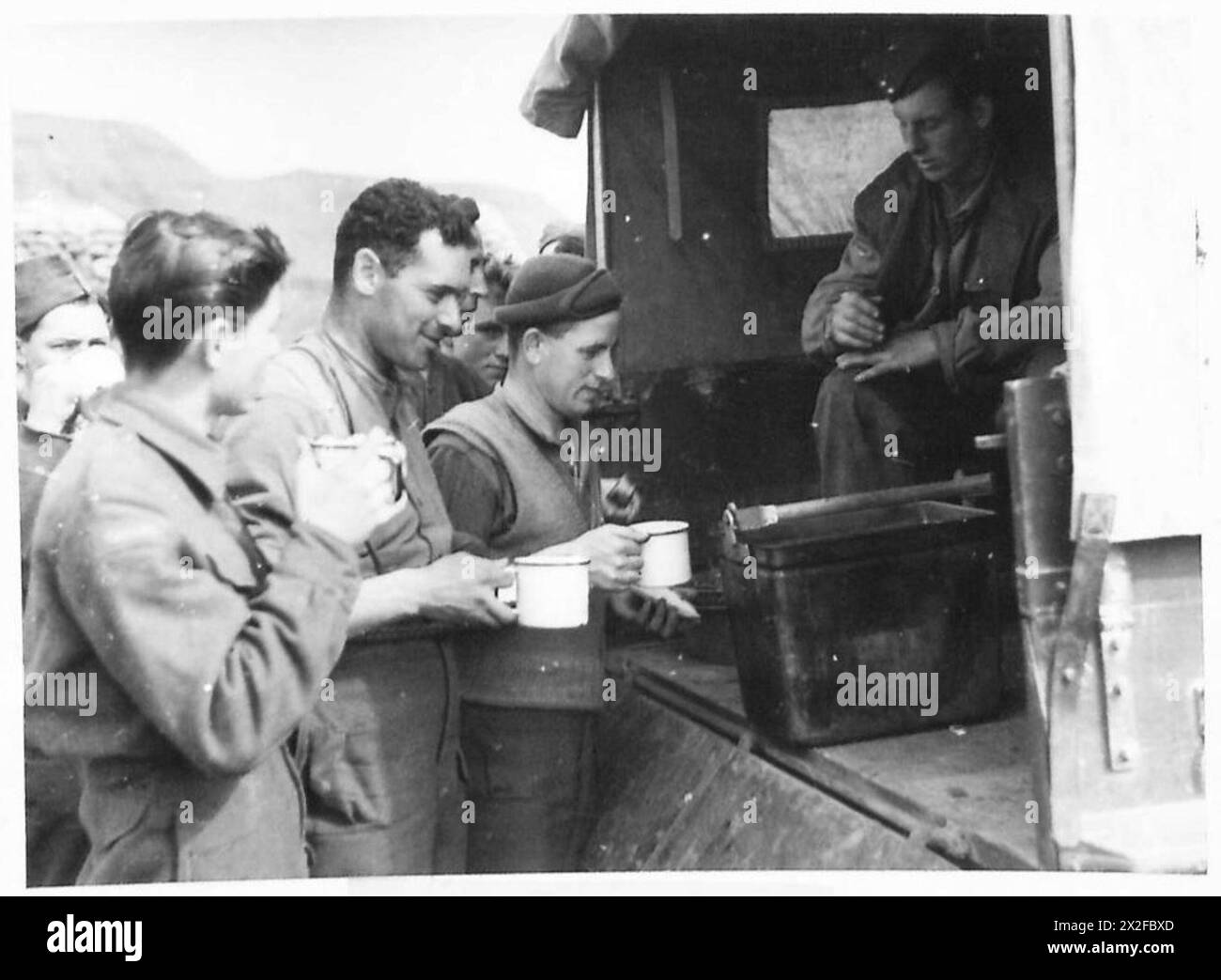Canadian troops in Iceland are shown enjoying a cup of tea during ...