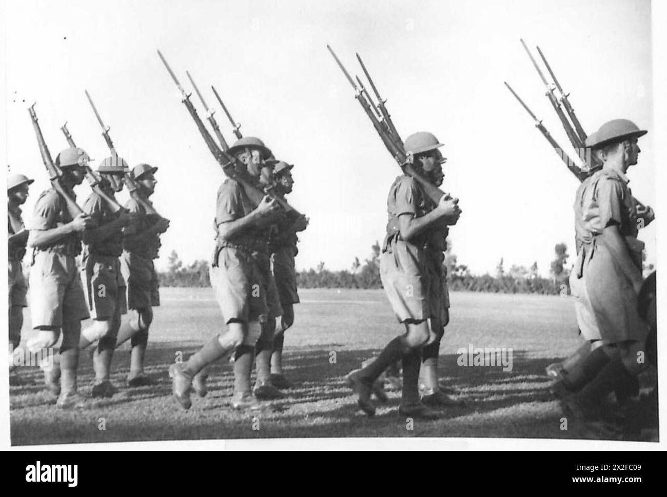 The British Ambassador reviews a Free French unit as it marches past a ...