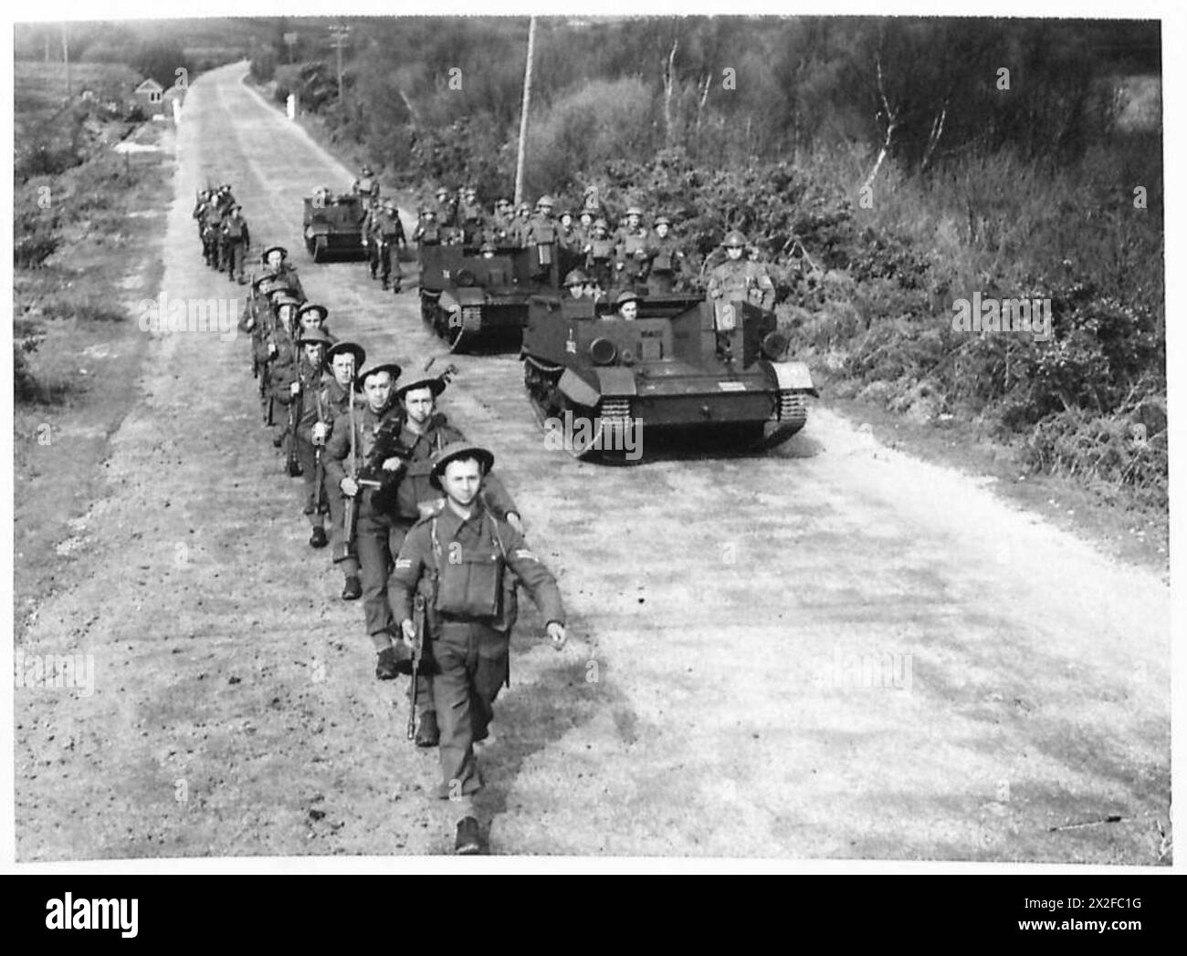 The Suffolk Regiment trains in offensive operations, marching in battle ...